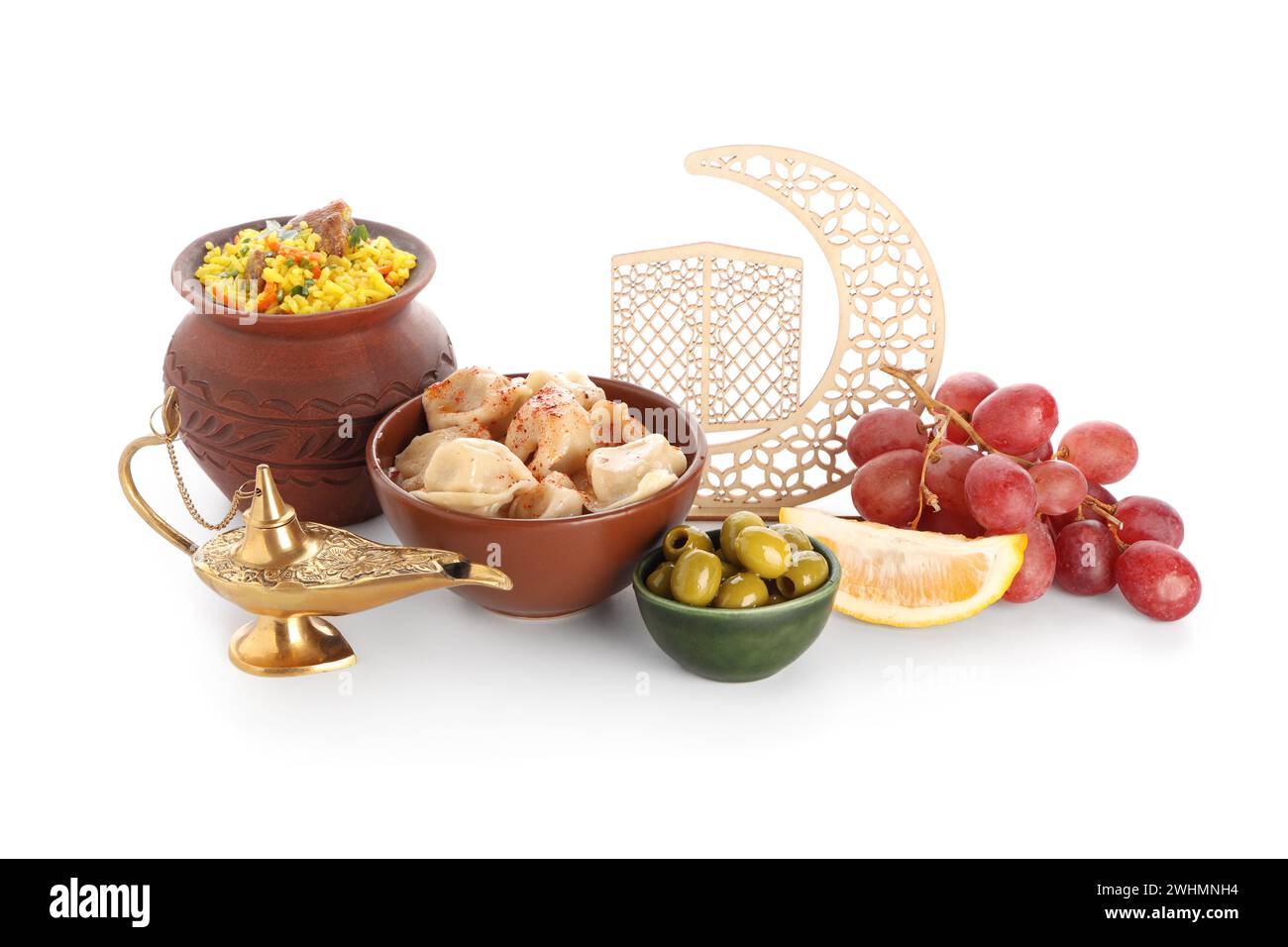 Traditional Eastern dishes, decorative crescent and Aladdin lamp on ...