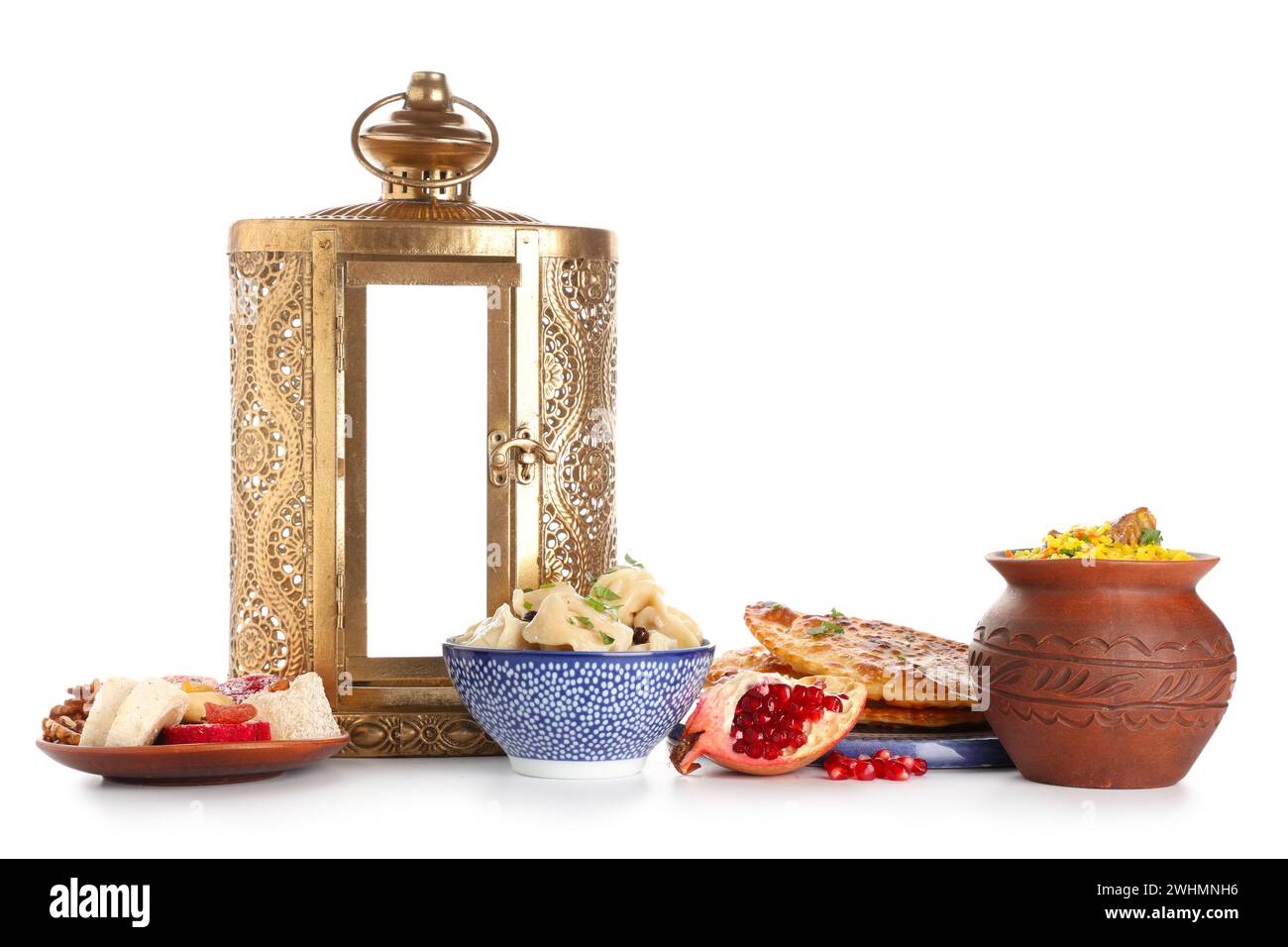 Traditional Eastern dishes and Muslim lantern on white background ...