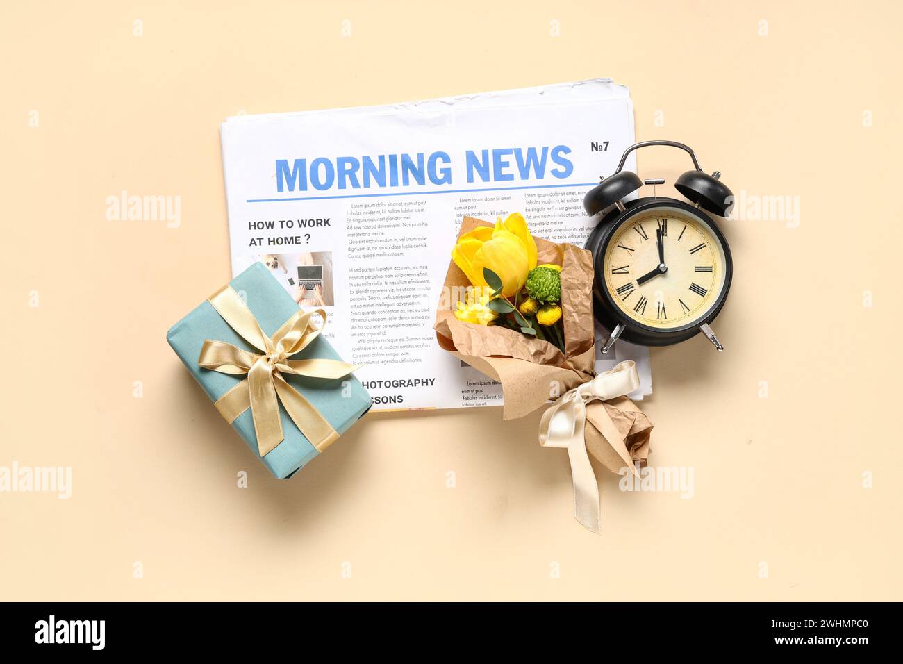 Mini bouquet of beautiful yellow spring flowers in wrapping paper with ...