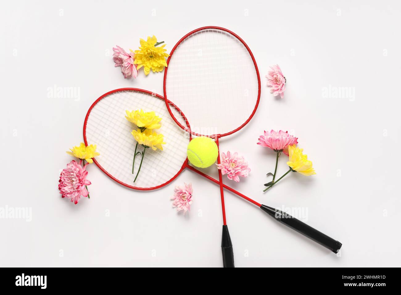 Composition with badminton rackets, ball and flowers for International ...