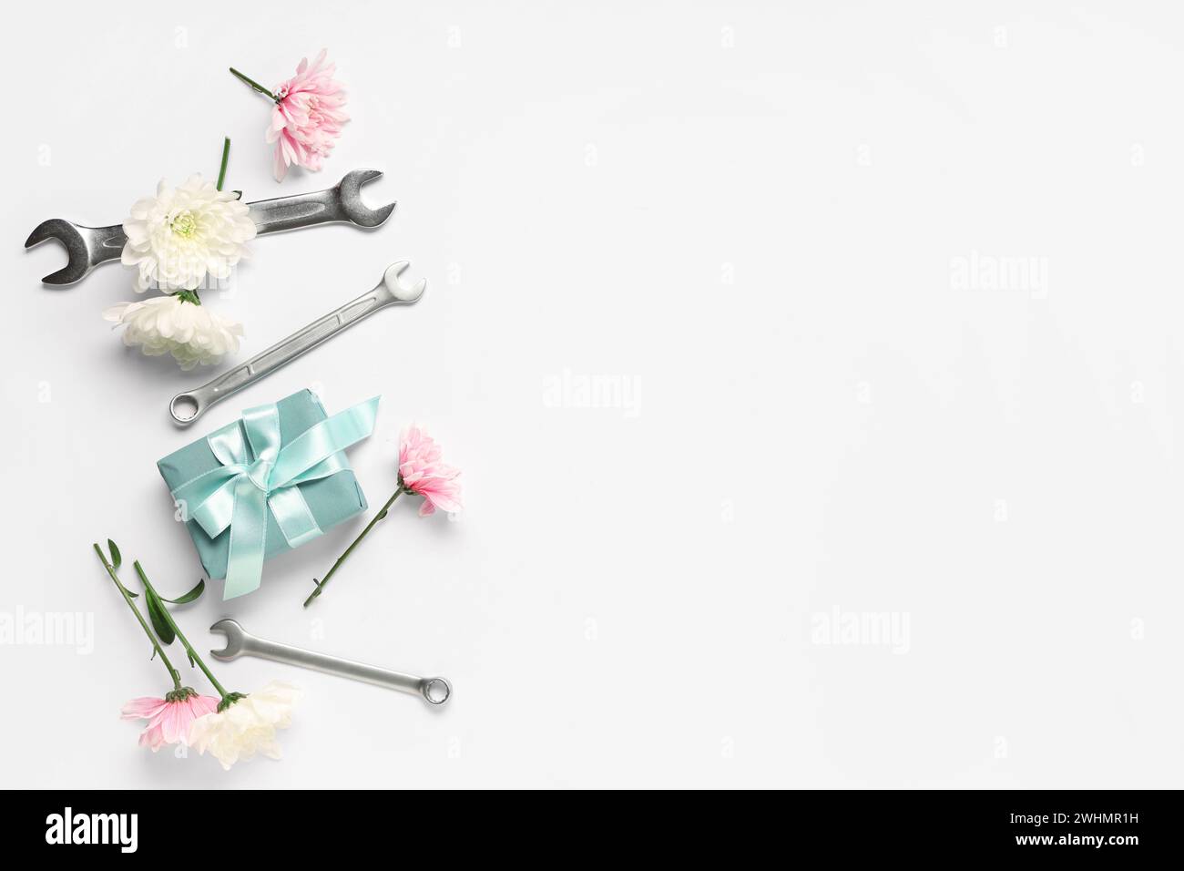 Composition with wrenches, gift box and flowers for International Women ...