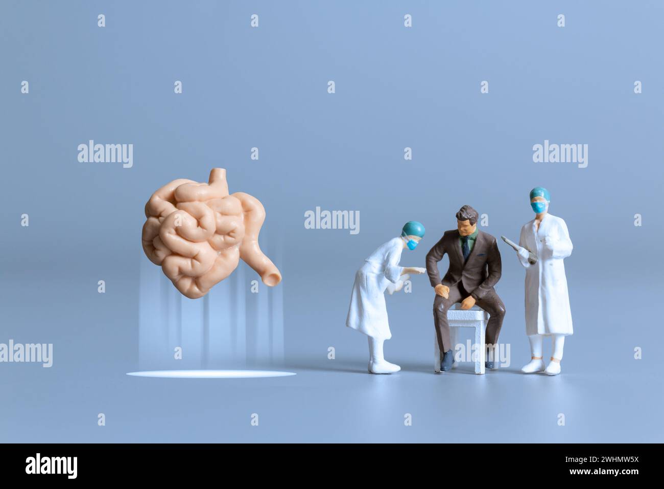Miniature Doctor studying and treating human small intestine Stock ...