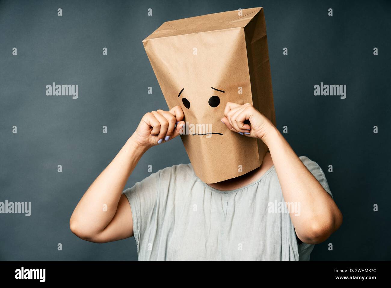 Woman with a bag over head hi-res stock photography and images - Alamy