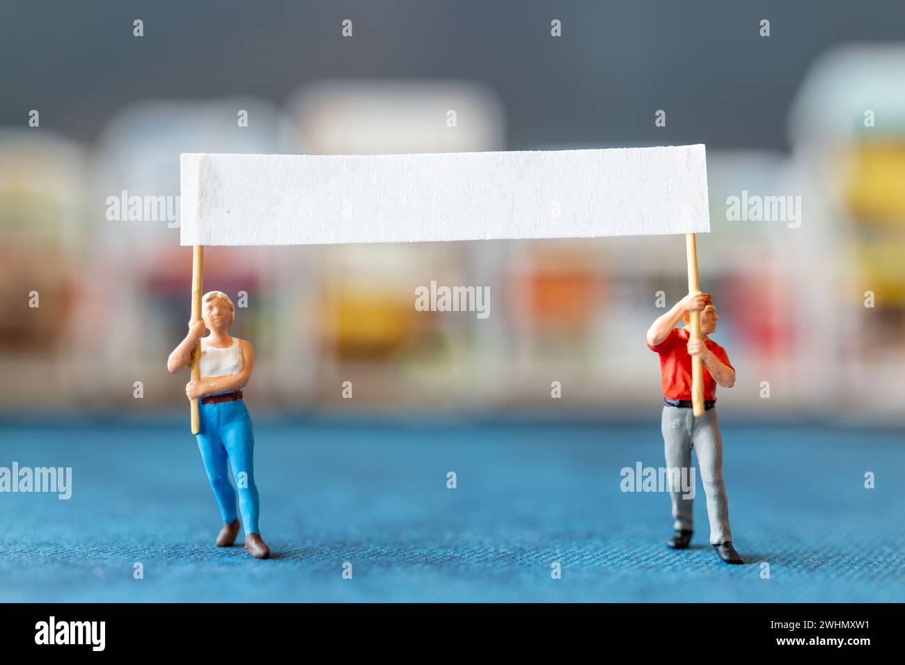 Miniature people, protesters holding signs, raising their hands Stock ...