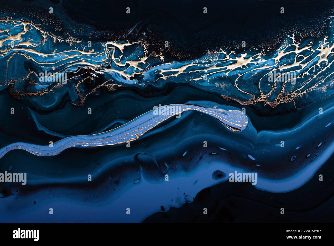 Fluid Art. Liquid Metallic Gold in abstract blue wave. Marble effect ...