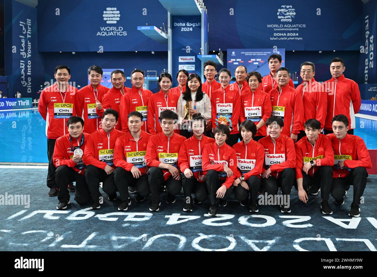 Doha. 10th Feb, 2024. China's diving athletes and coaches pose with the ...