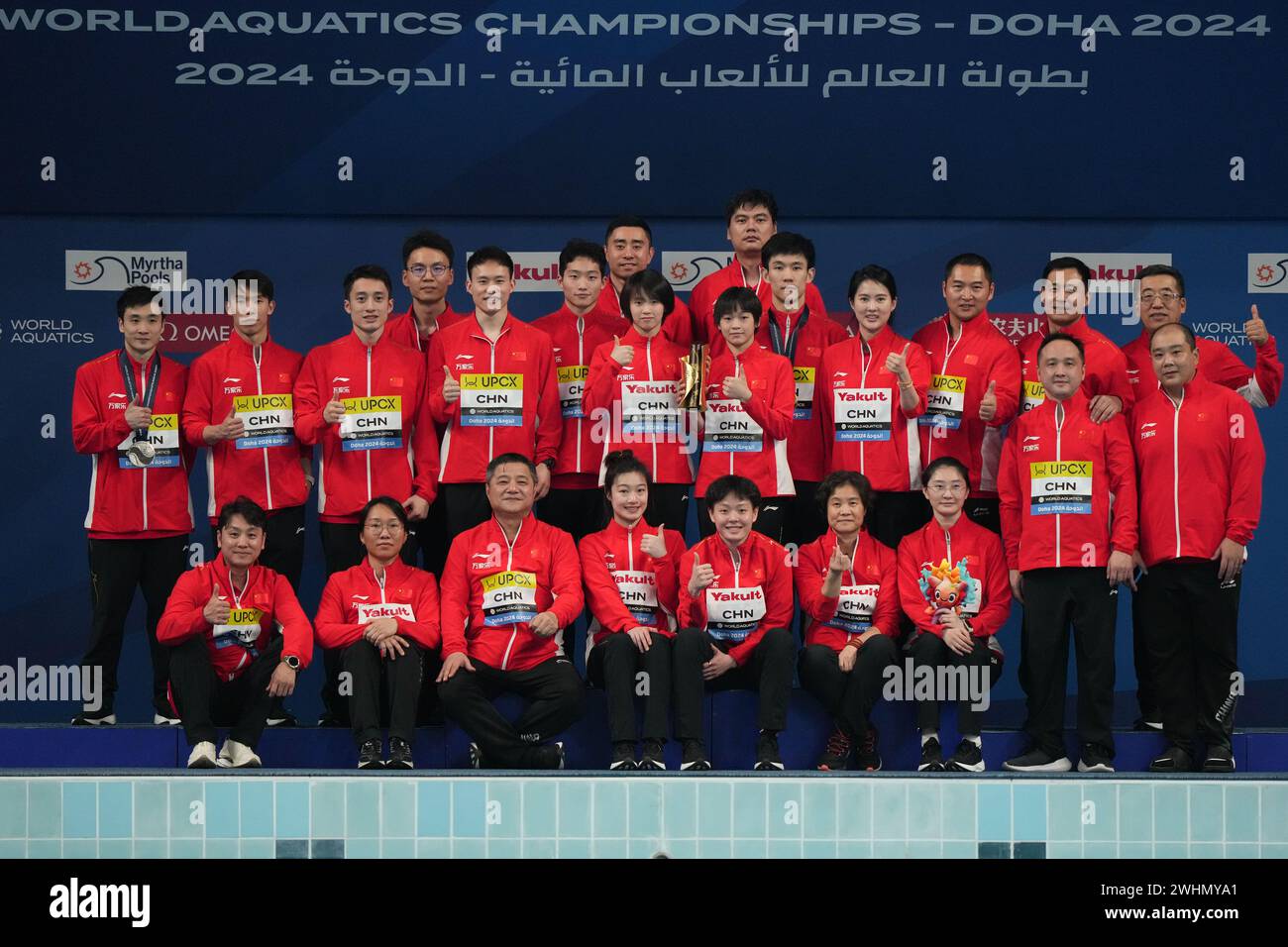 Doha. 10th Feb, 2024. China's diving athletes and coaches pose with the ...