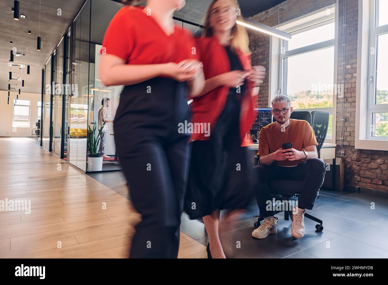 A diverse group of business professionals collaborates in a modern ...