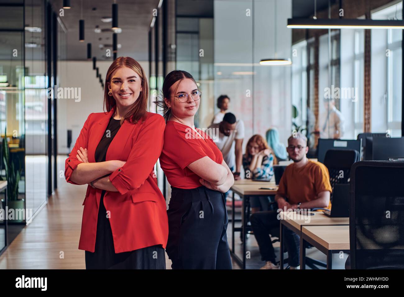 Group of determined businesswomen confidently pose side by side in a ...