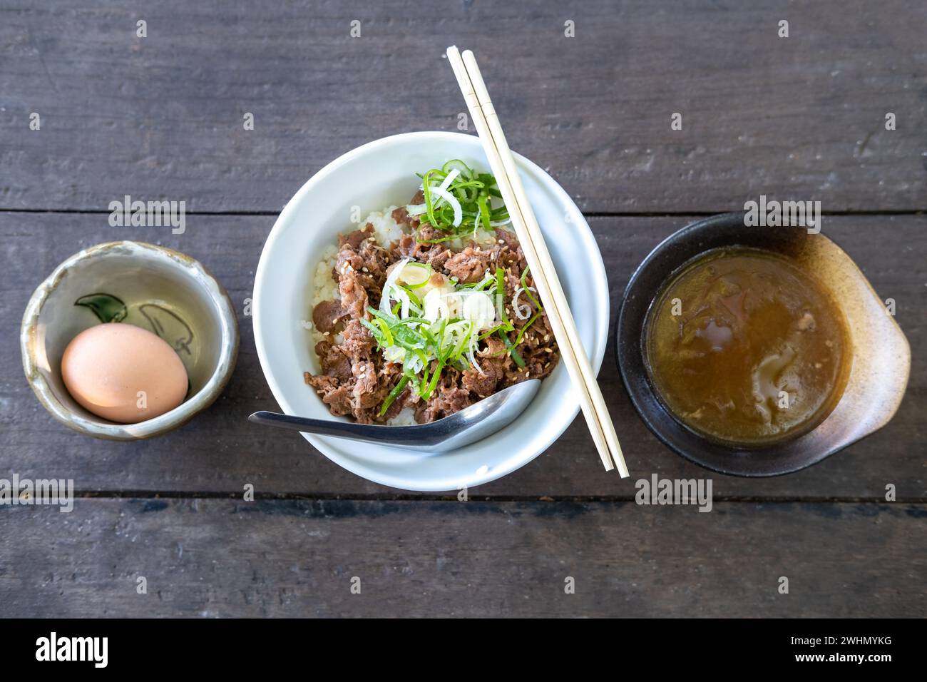 Japanese Gyudon or sliced beef cooked with sauce on rice. Serve with ...