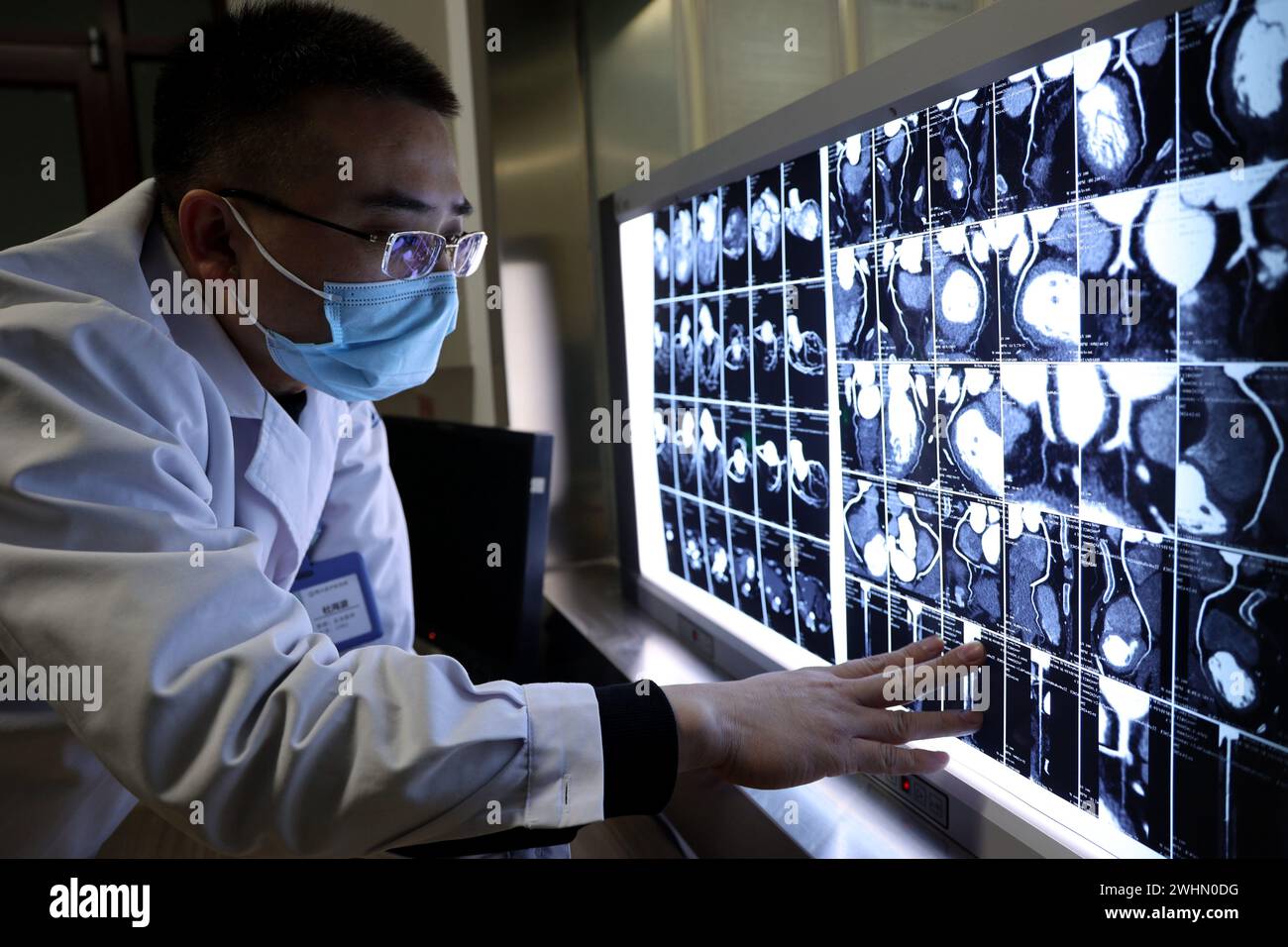 BINZHOU, CHINA - FEBRUARY 10, 2024 - A doctor on duty checks a patient ...