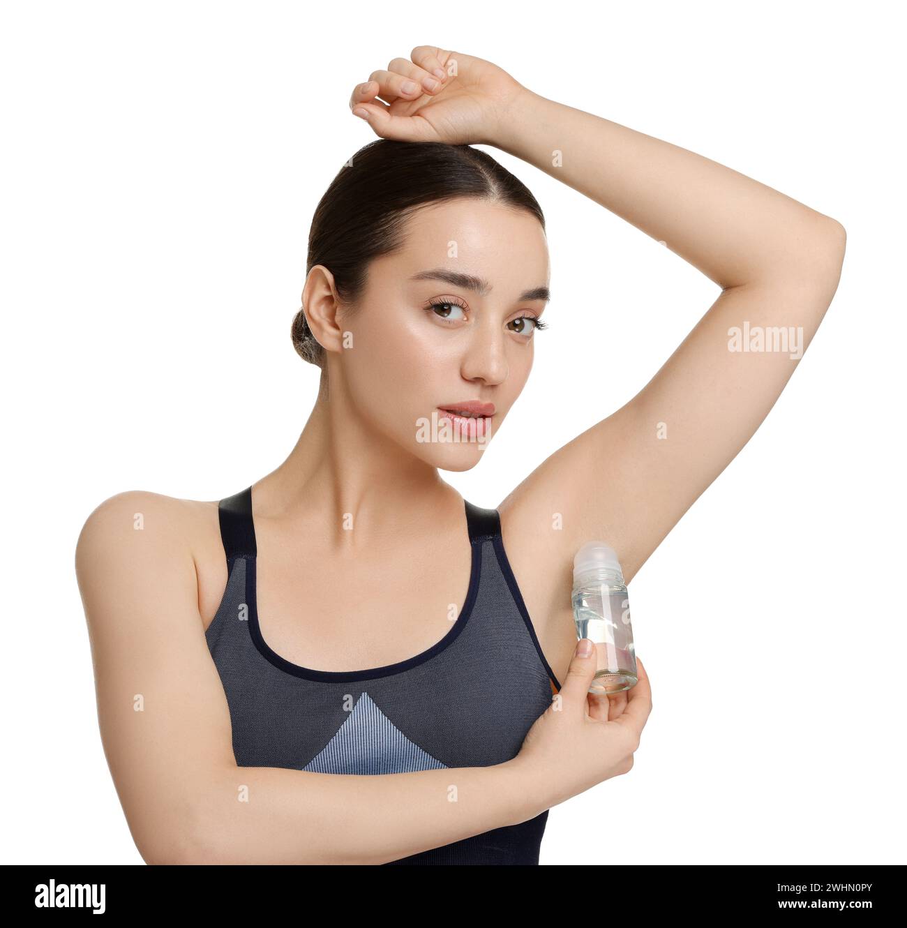 Beautiful woman applying deodorant on white background Stock Photo - Alamy