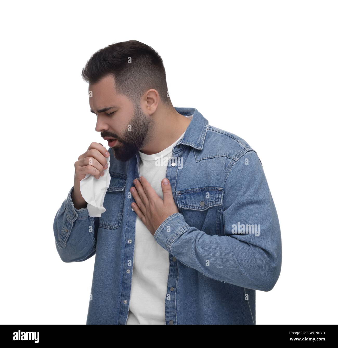 Sick man with tissue coughing on white background Stock Photo - Alamy