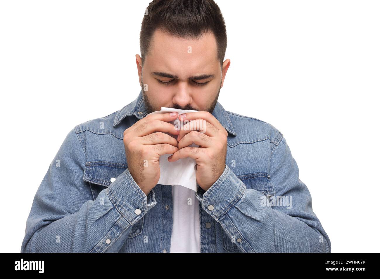 Sick man with tissue coughing on white background Stock Photo - Alamy