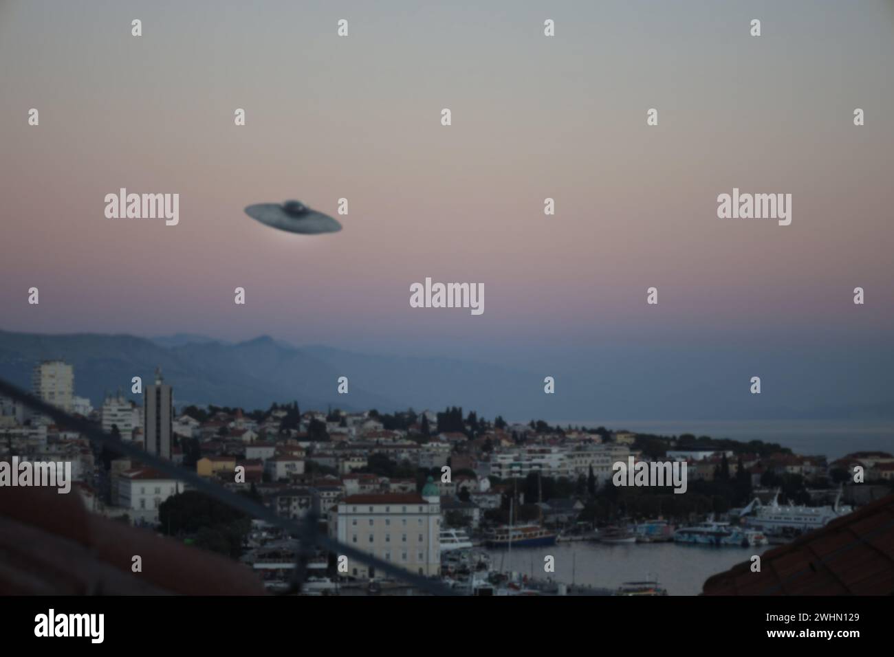 Alien spaceship flying over city in morning. UFO, extraterrestrial ...