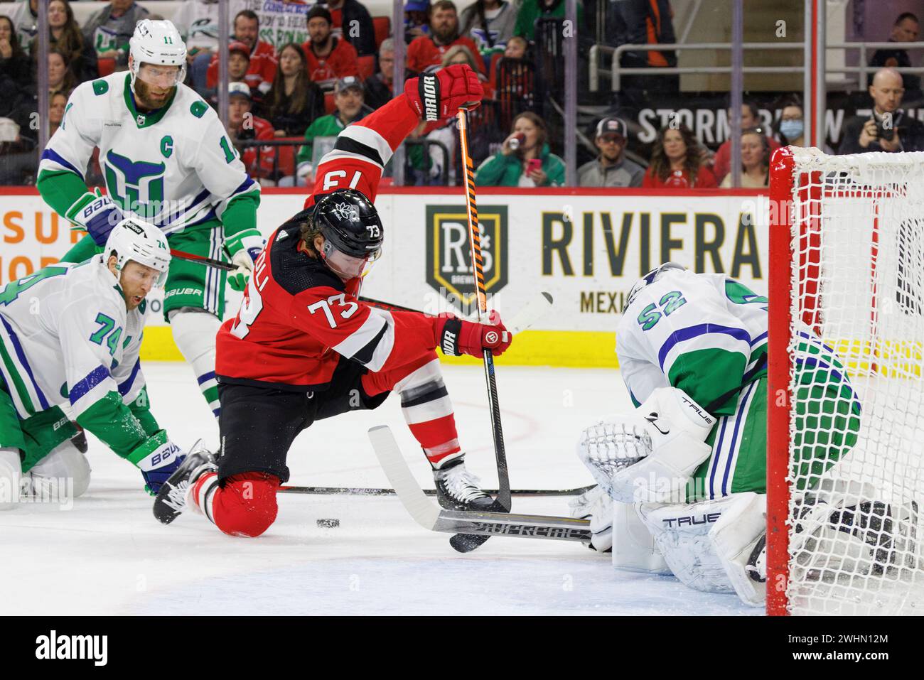 New Jersey Devils' Tyler Toffoli (73) handles the puck between Carolina ...