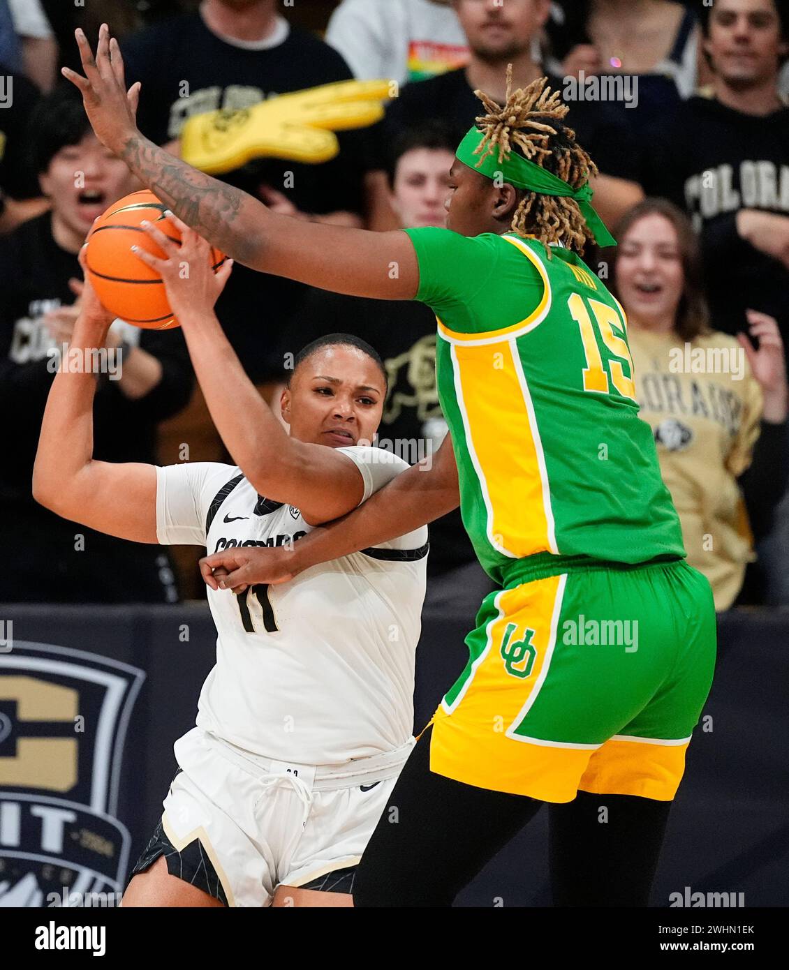 Colorado forward Quay Miller (11) looks to pass the ball as Oregon ...