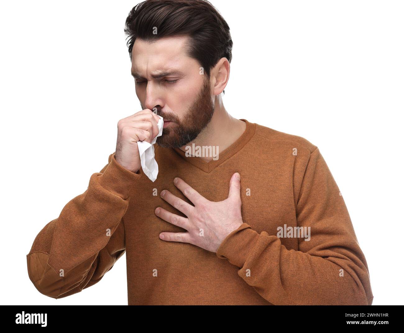 Sick man with tissue coughing on white background Stock Photo - Alamy