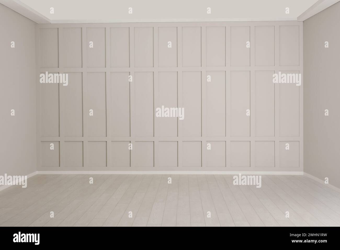 Empty room with beige walls and laminated flooring Stock Photo - Alamy