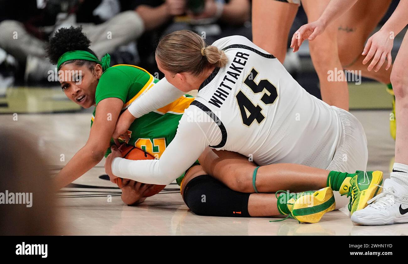 Oregon guard Kennedi Williams (12) collects a loose ball as Colorado ...