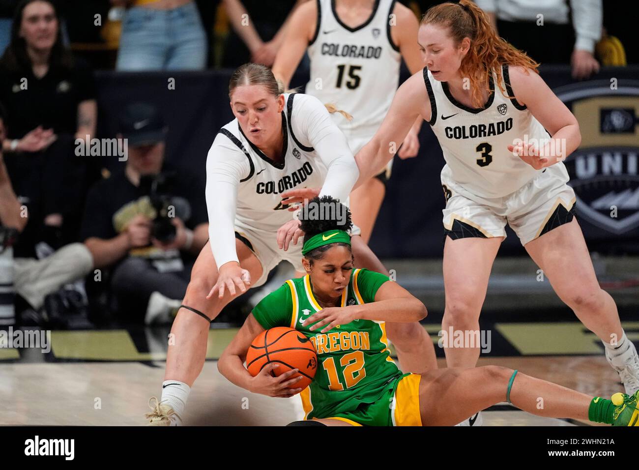 Oregon guard Kennedi Williams (12) collects a loose ball as Colorado ...