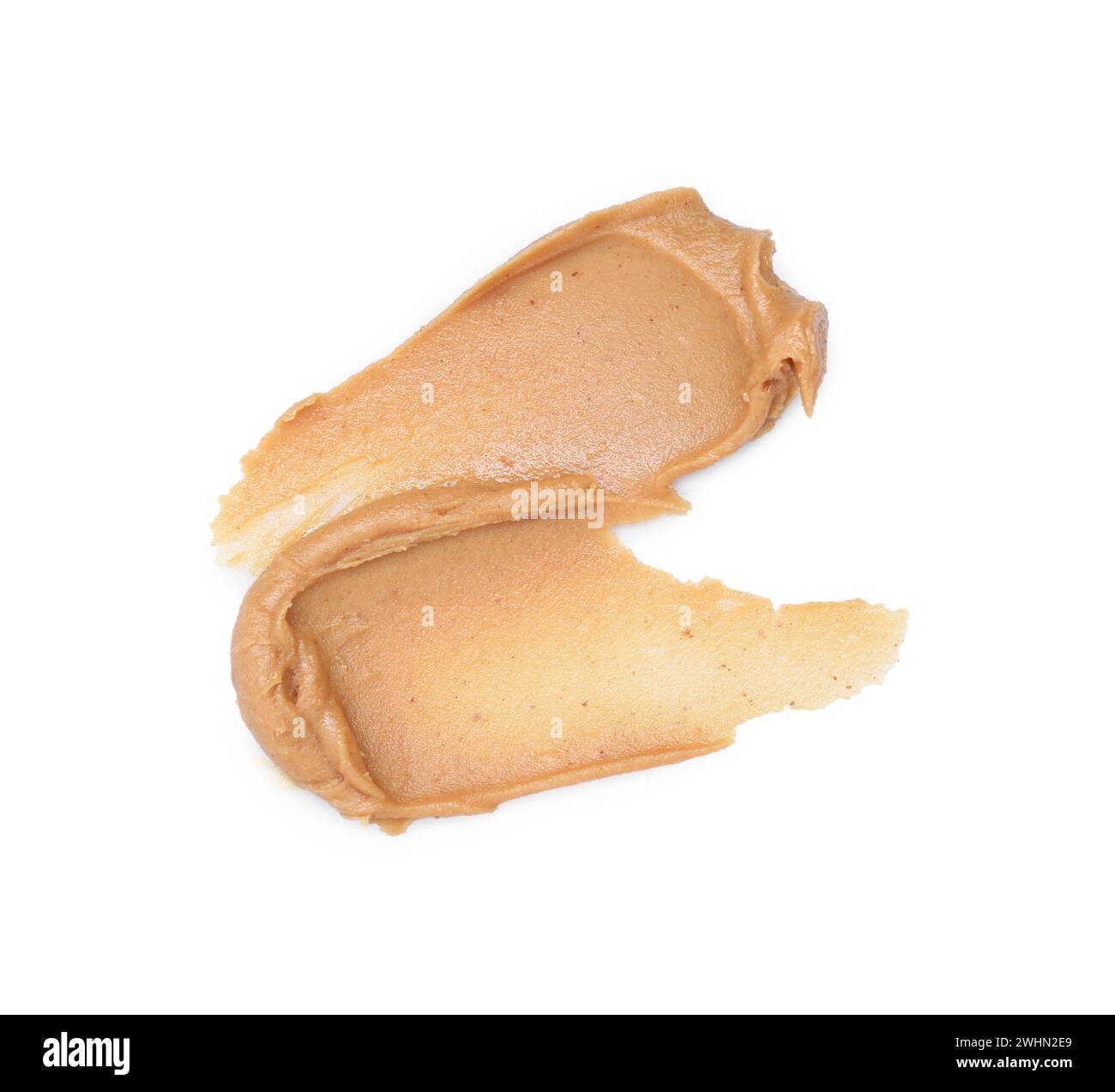 Smears of tasty nut butter isolated on white, top view Stock Photo - Alamy