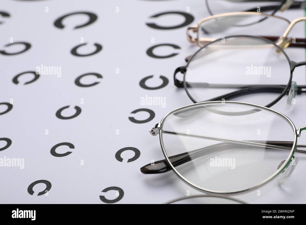 Vision test chart and different glasses, closeup Stock Photo - Alamy