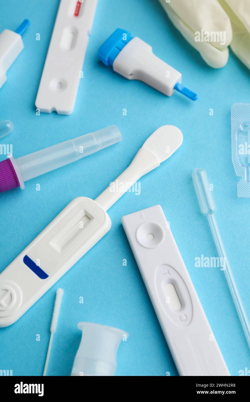 Disposable express test kits on light blue background Stock Photo - Alamy