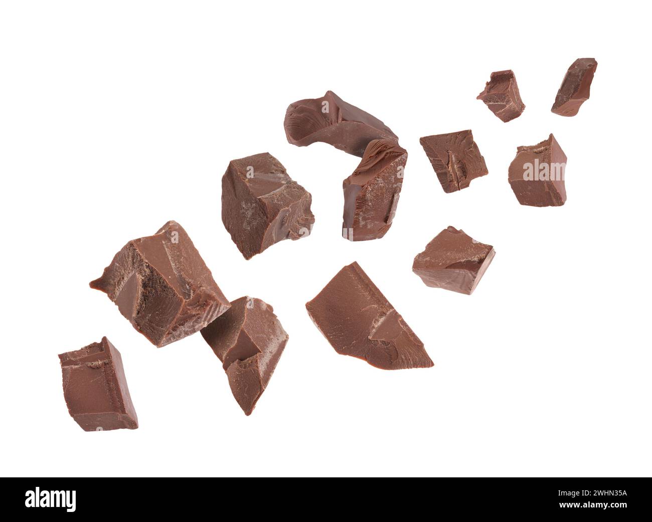 Tasty chocolate chunks falling on white background Stock Photo - Alamy