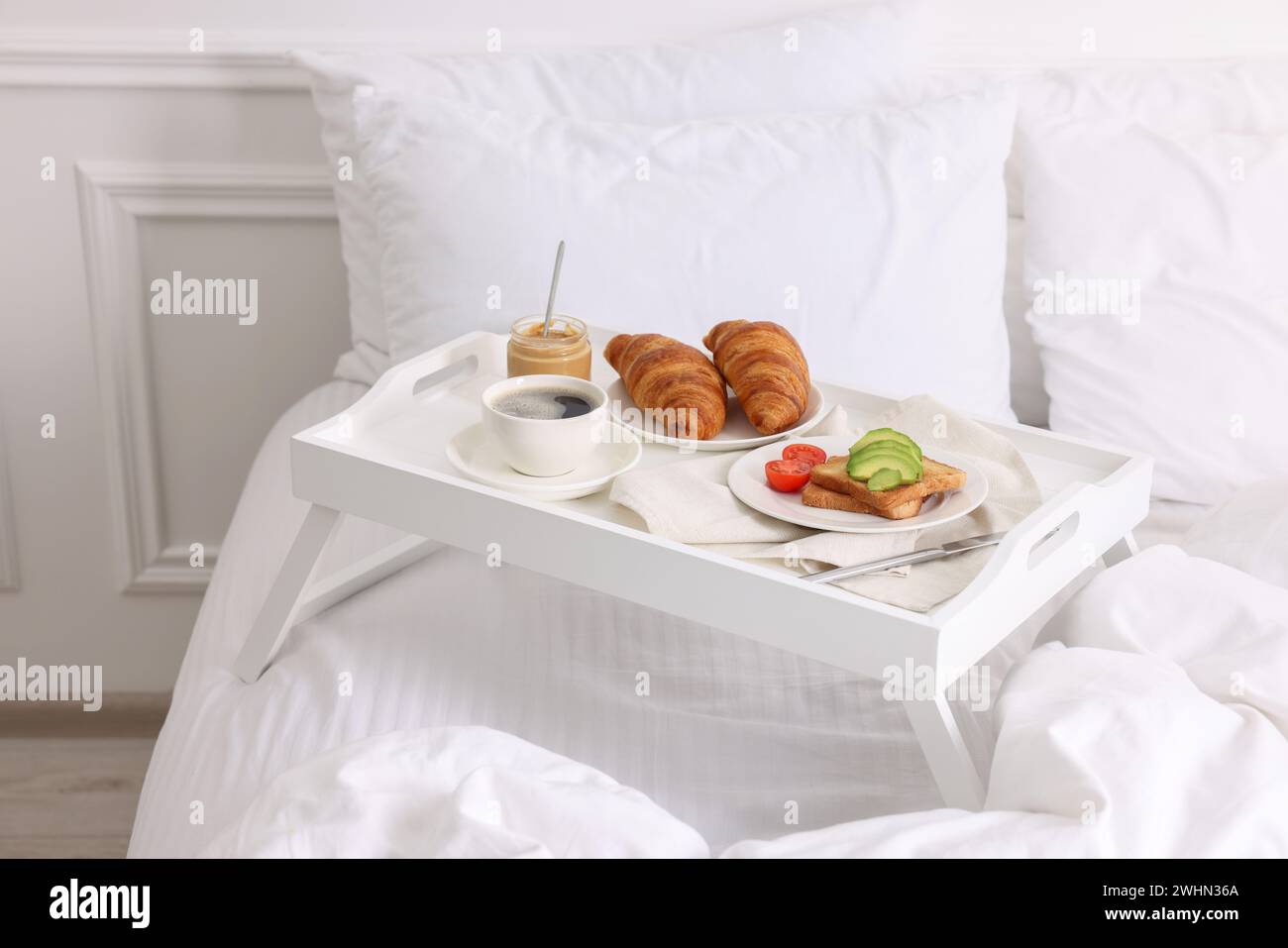 Good morning. Tray with tasty breakfast on bed at home Stock Photo - Alamy