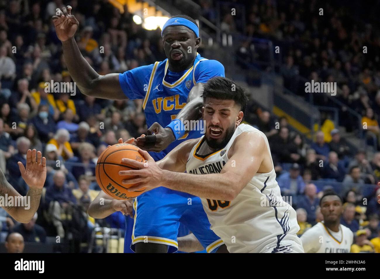 California forward Fardaws Aimaq, bottom, grabs a rebound in front of ...