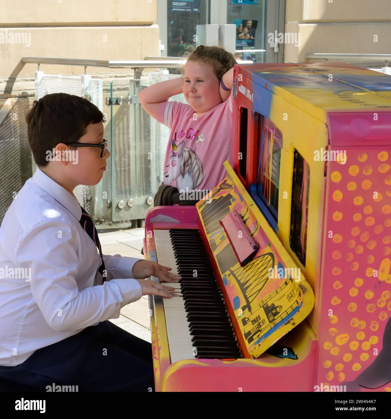 Piano covering ears hi-res stock photography and images - Alamy