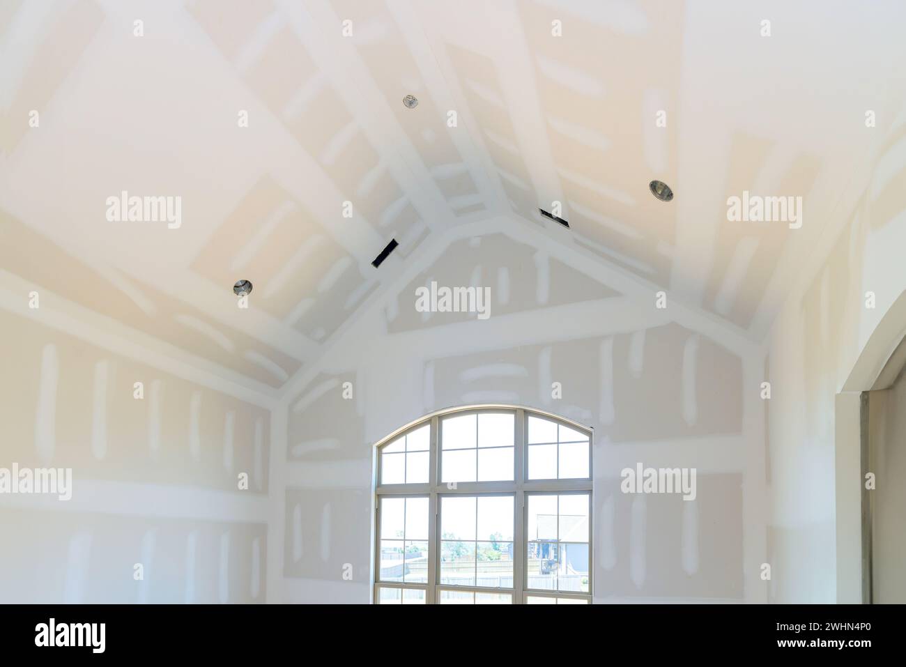 Plastering finishing the drywall for painting on newly constructed ...