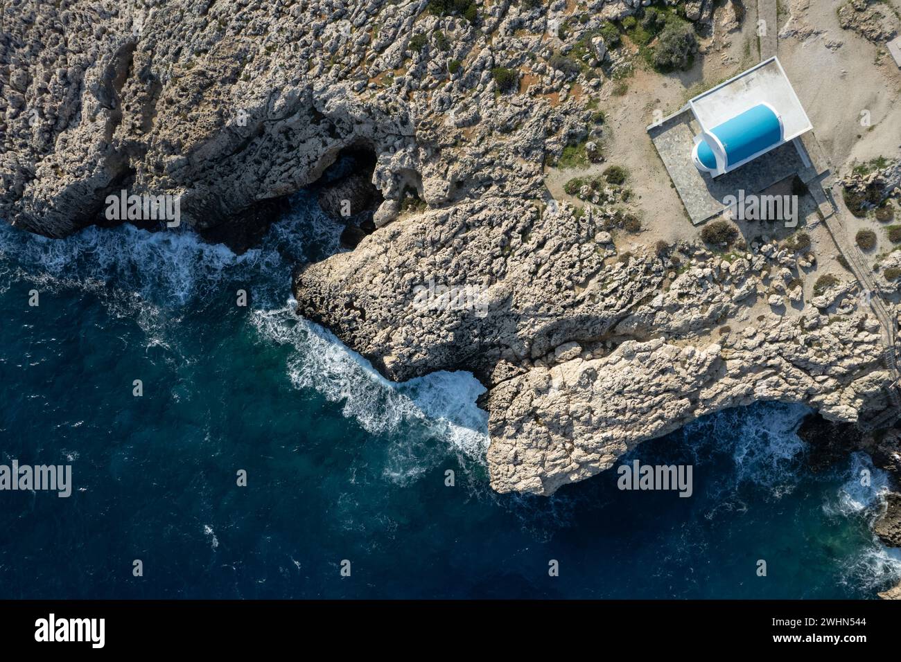 Drone aerial scenery of Cape Greco peninsula with christian church on ...
