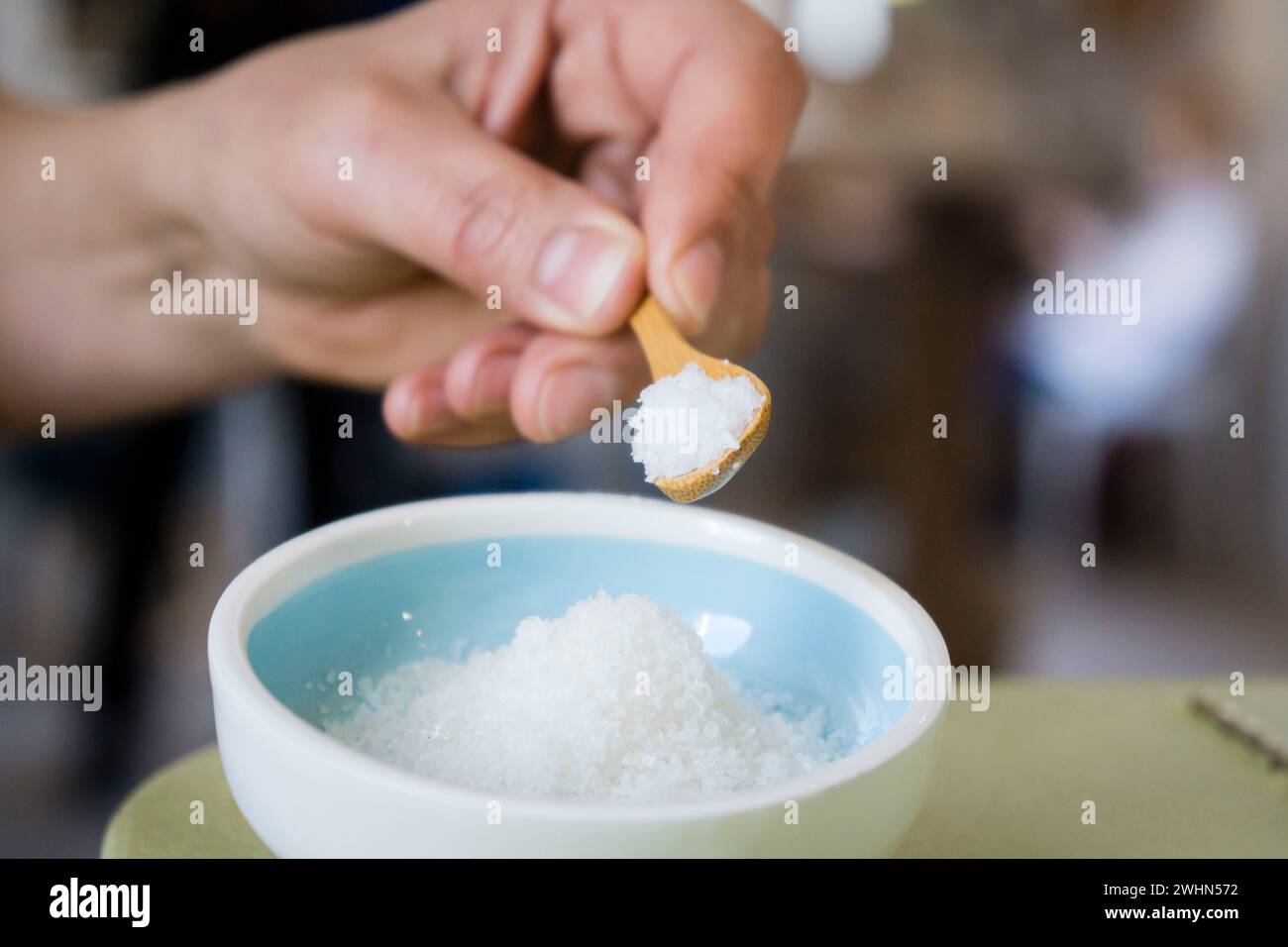 Hands with a pile of salt Stock Photo - Alamy
