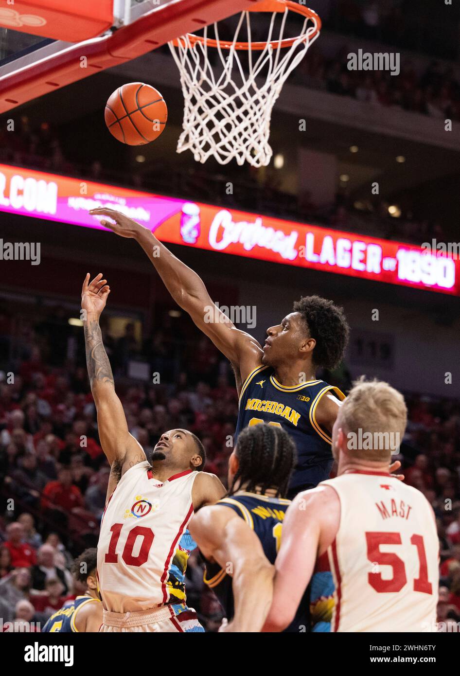 Nebraska's Jamarques Lawrence, left, shoots against Michigan's Tarris ...