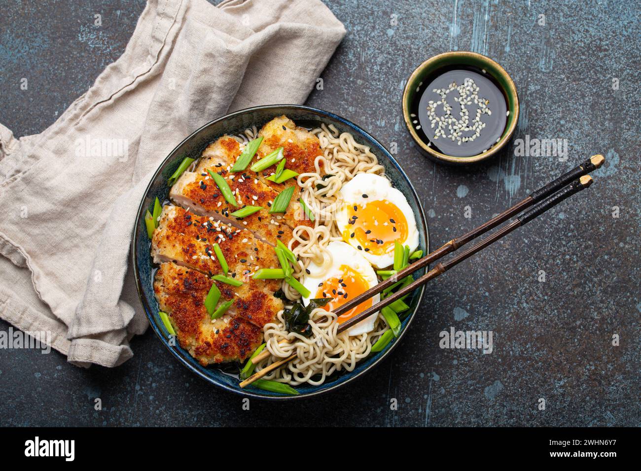 Asian noodles ramen soup with deep fried panko chicken fillet and ...