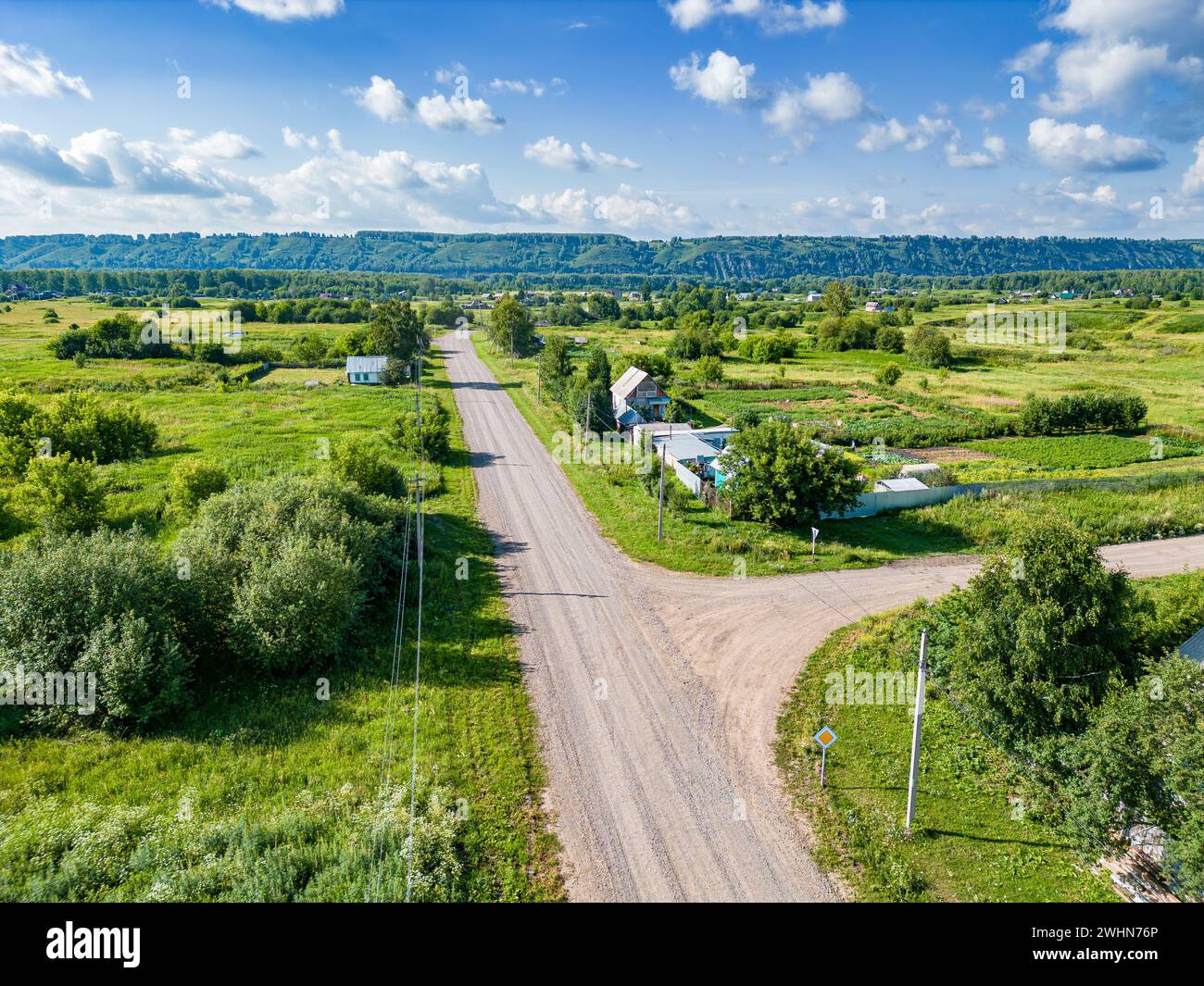 Crossroads of rural streets in a village with few houses, country roads ...