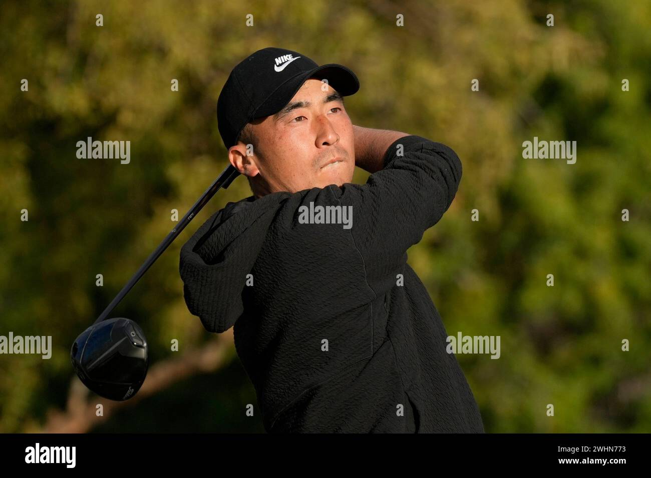Doug Ghim watches his tee shot on the fifth hole during the third round ...