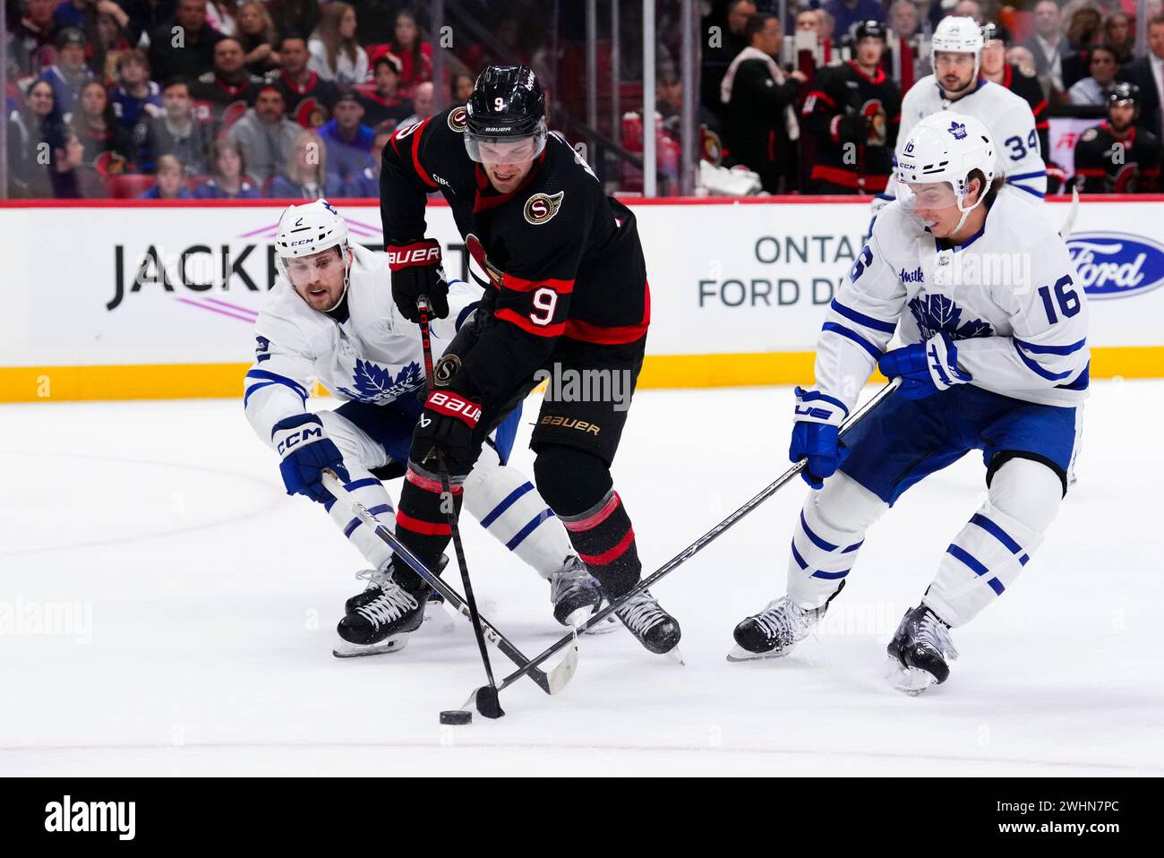 Ottawa Senators center Josh Norris (9) moves the puck between Toronto ...