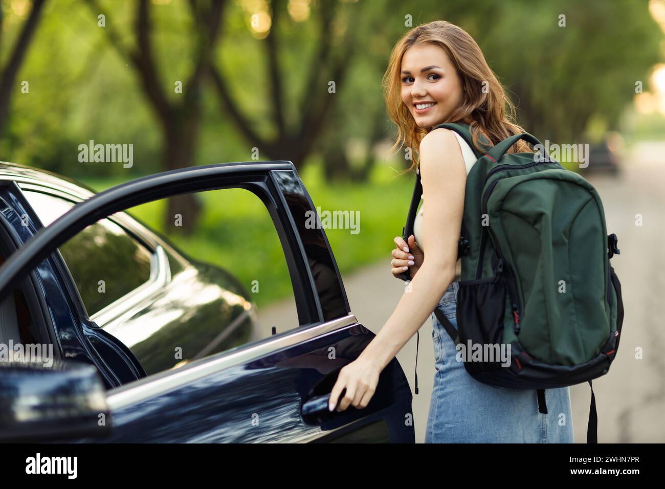 Happy woman driver at car smiling. Cute young happy brunette female ...