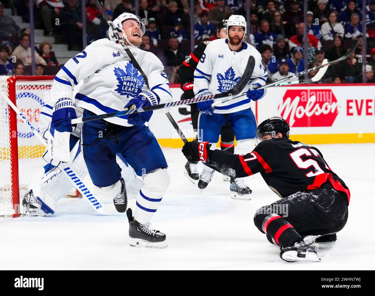 Toronto Maple Leafs defenseman Jake McCabe (22) takes a stick to the ...