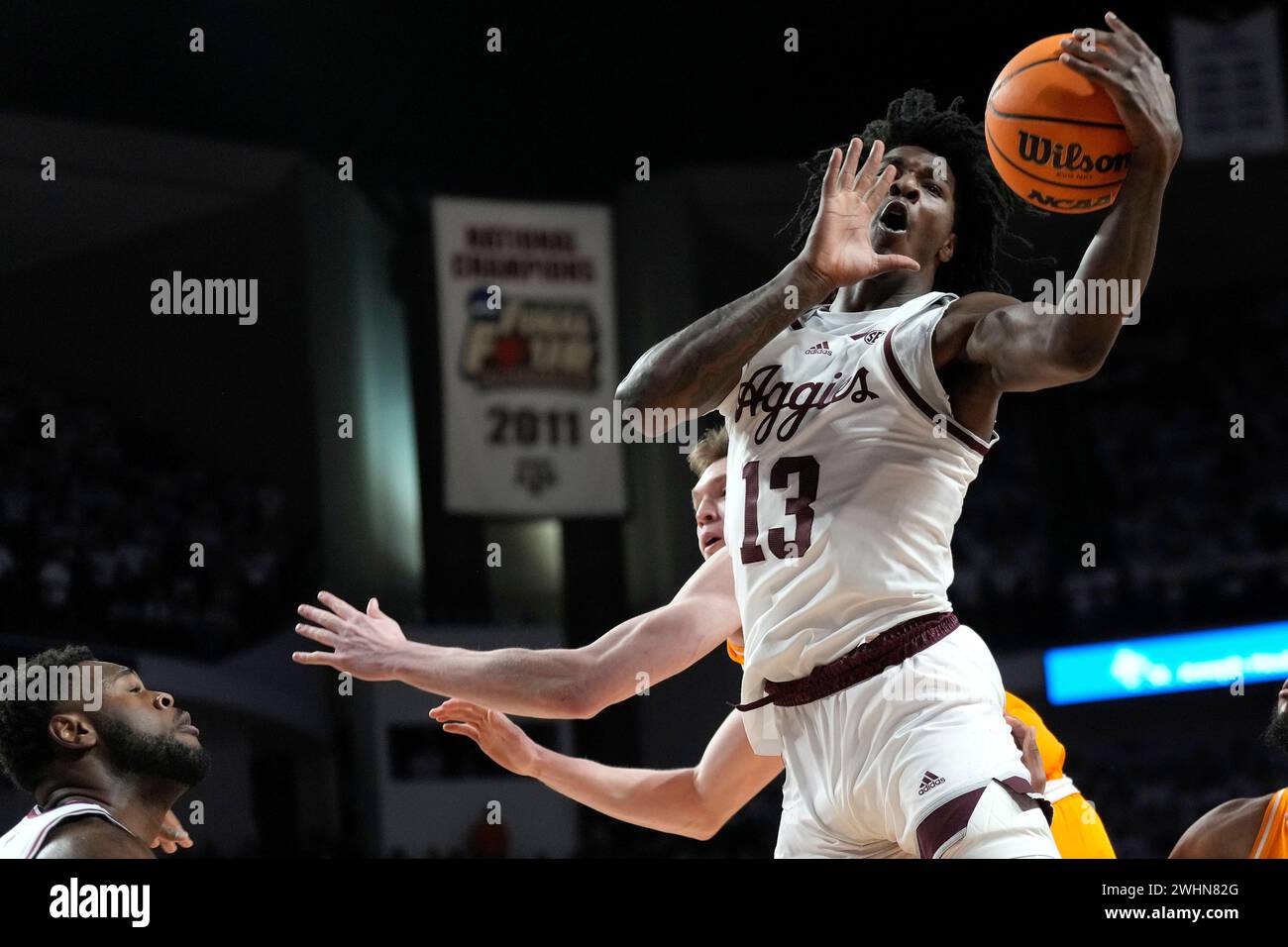 Texas A&M forward Solomon Washington (13) grabs a rebound over ...
