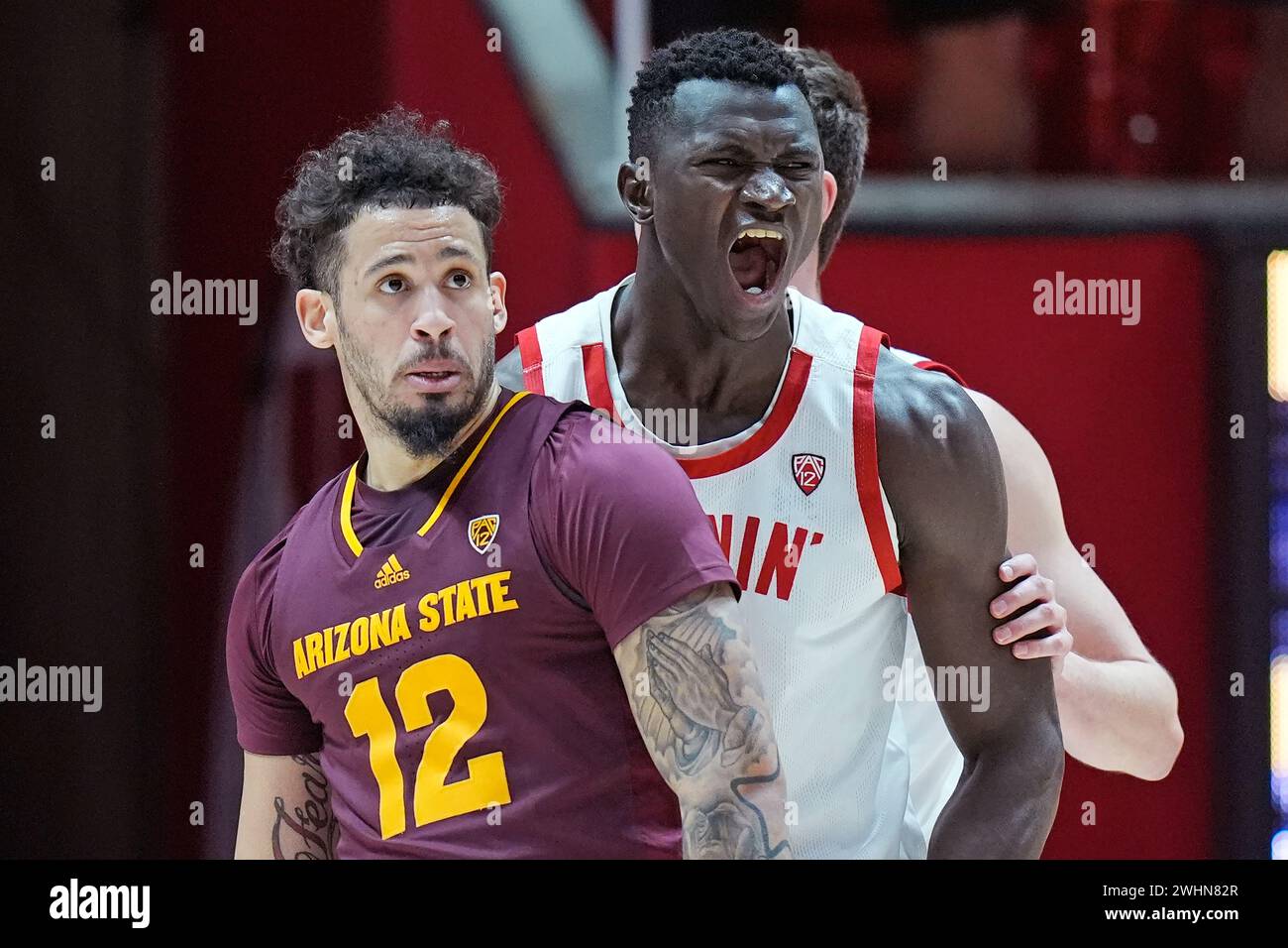 Utah center Keba Keita, right reacts after scoring, next to Arizona ...