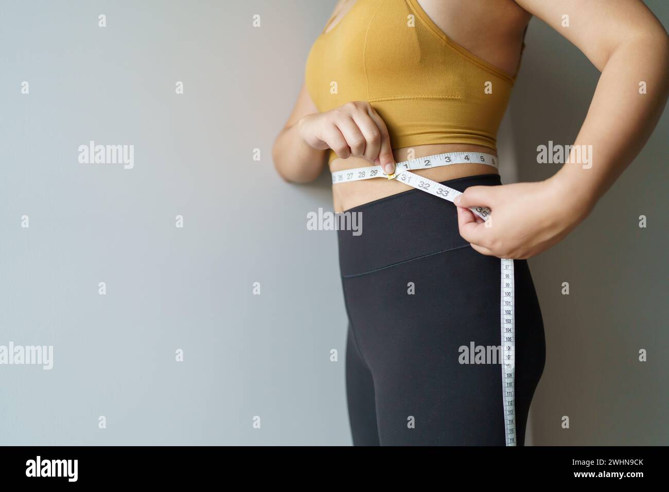 Woman want to lose weight with a centimeter Shape up healthy stomach ...