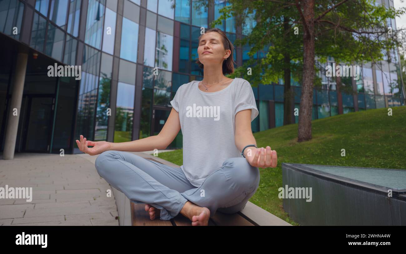 De-stress, unwind idea. peaceful female freelance employee practicing ...