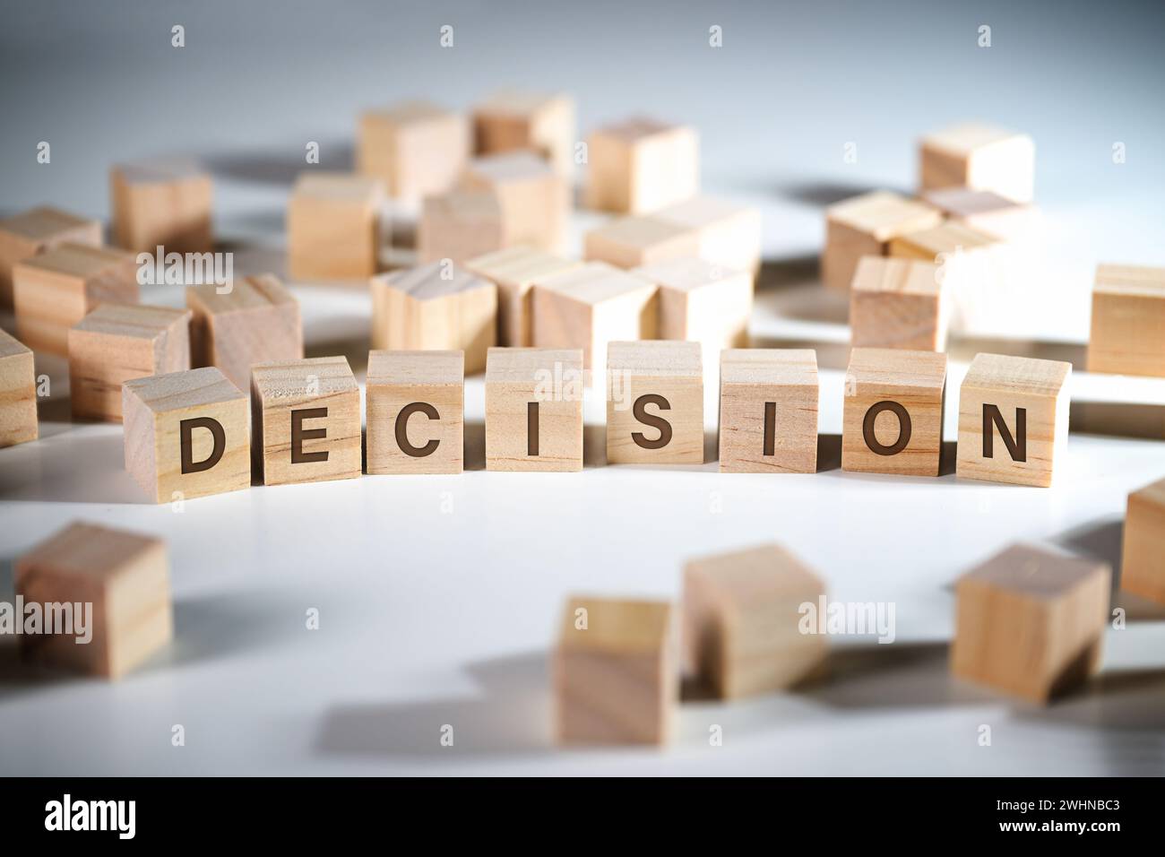 Word DECISION written on wooden cubes among a lot of others, concept to ...