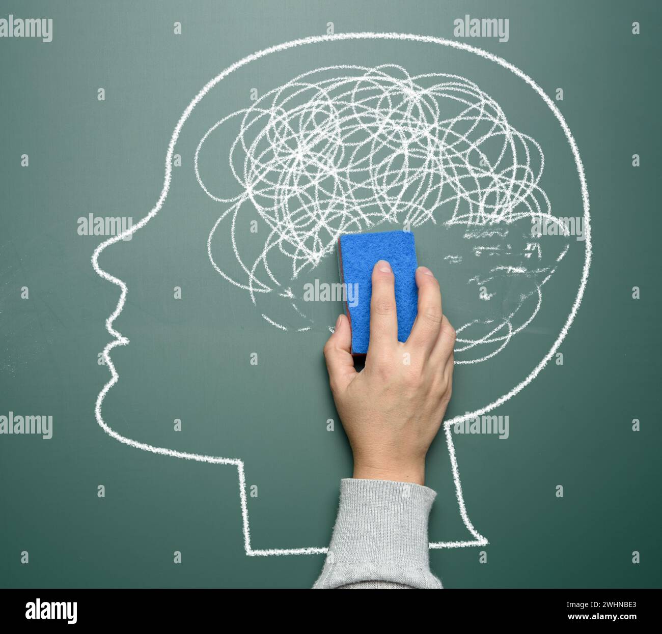 The head is drawn in white chalk and is in profile. The head has a ...