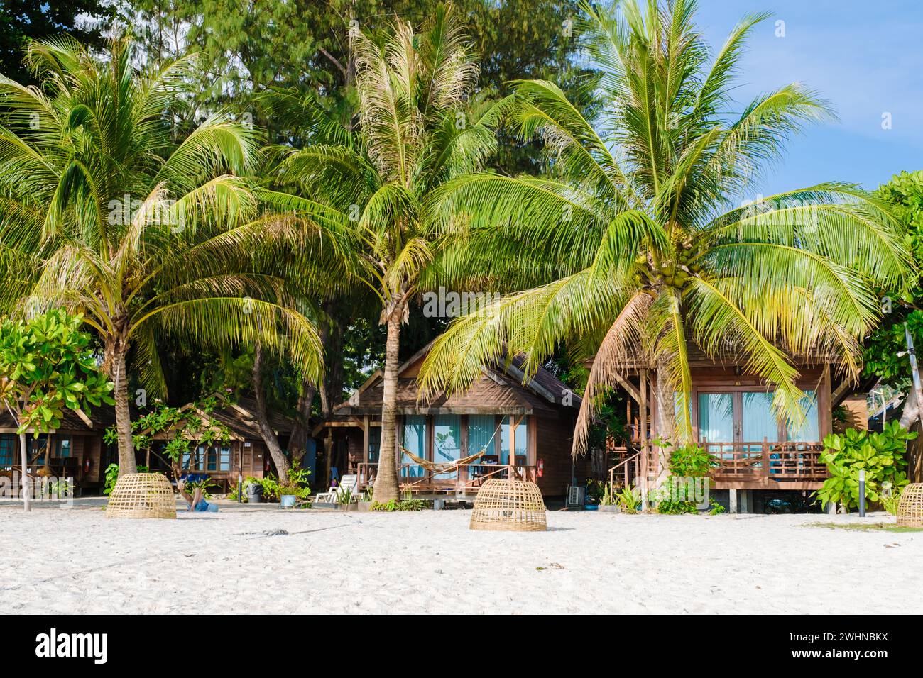 Bamboo hut bungalows on the beach in Thailand Stock Photo - Alamy