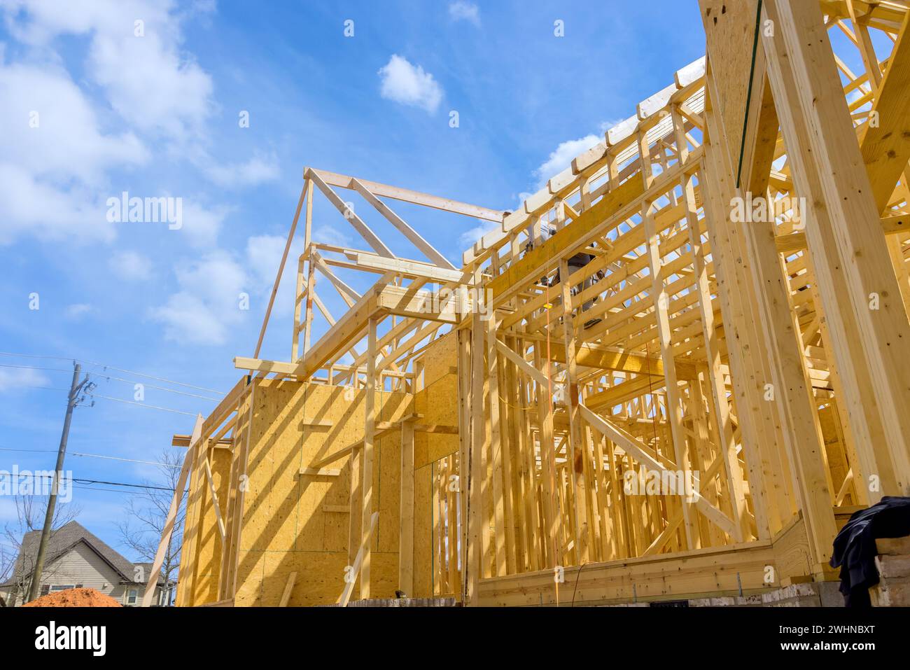 House with wooden framework frame is being constructed with support ...
